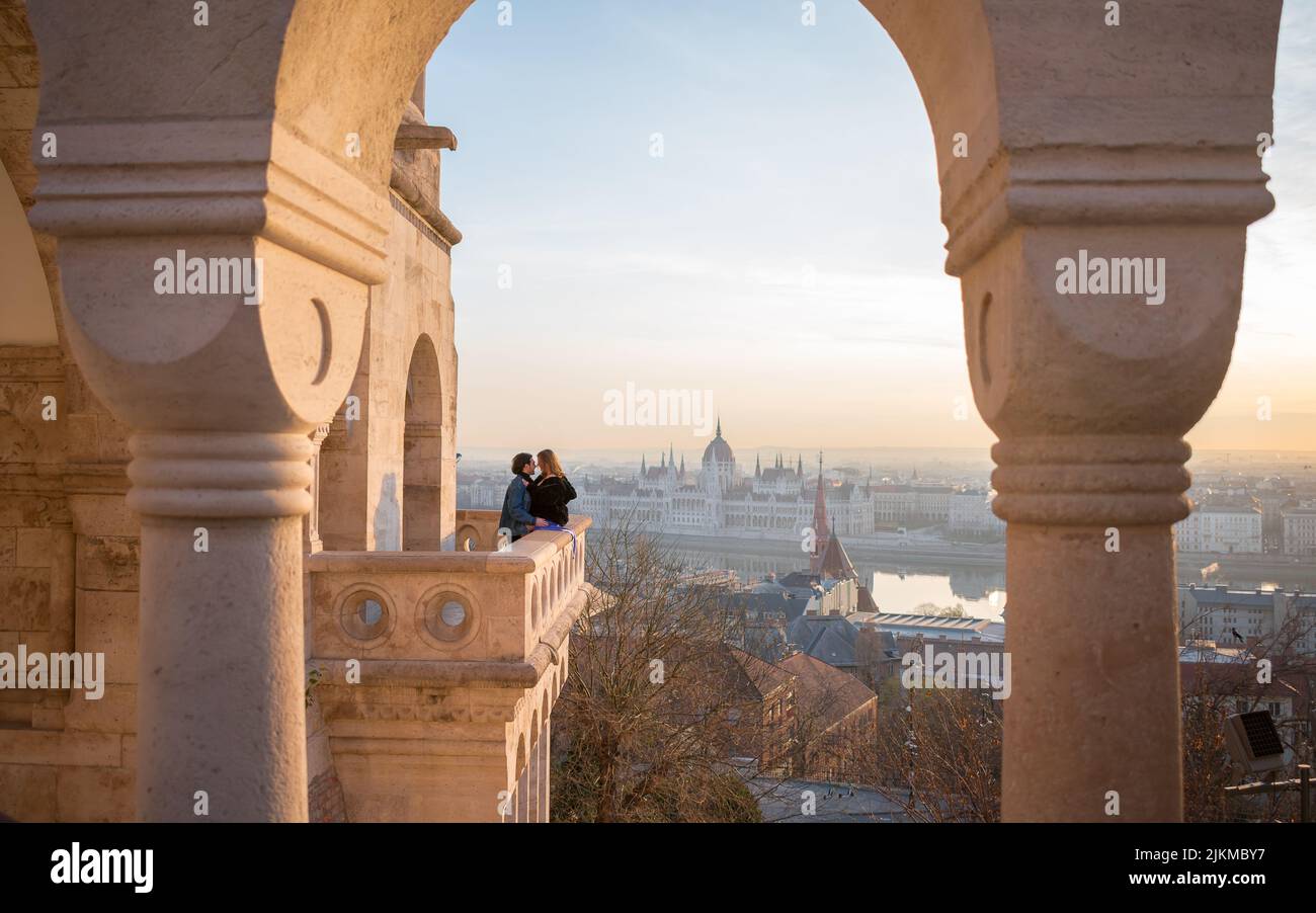 A romantic couple on the Parliament balcony in the city of Budapest ...