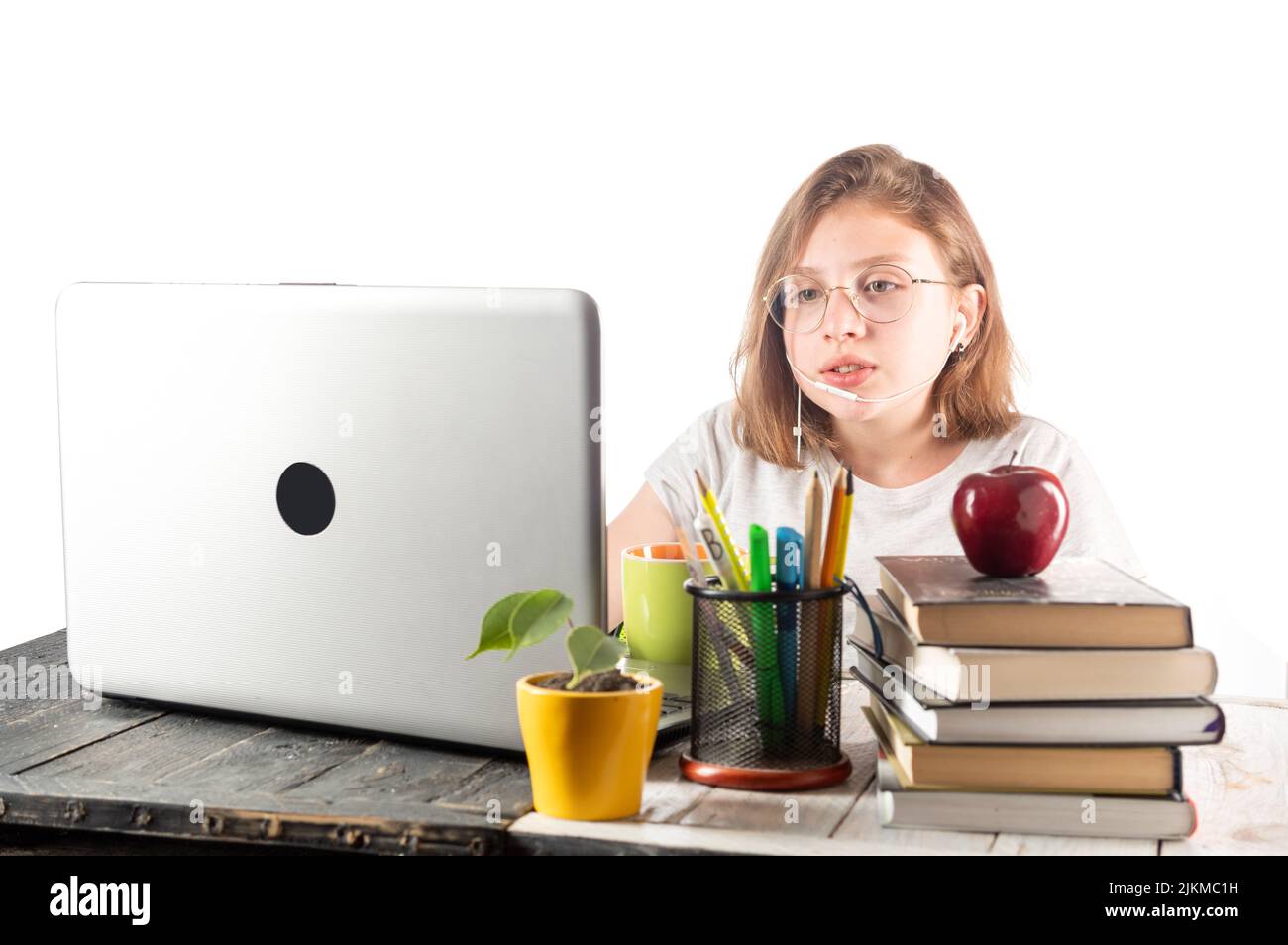 Learn from a laptop. Do homework near the laptop. Video conference with ...