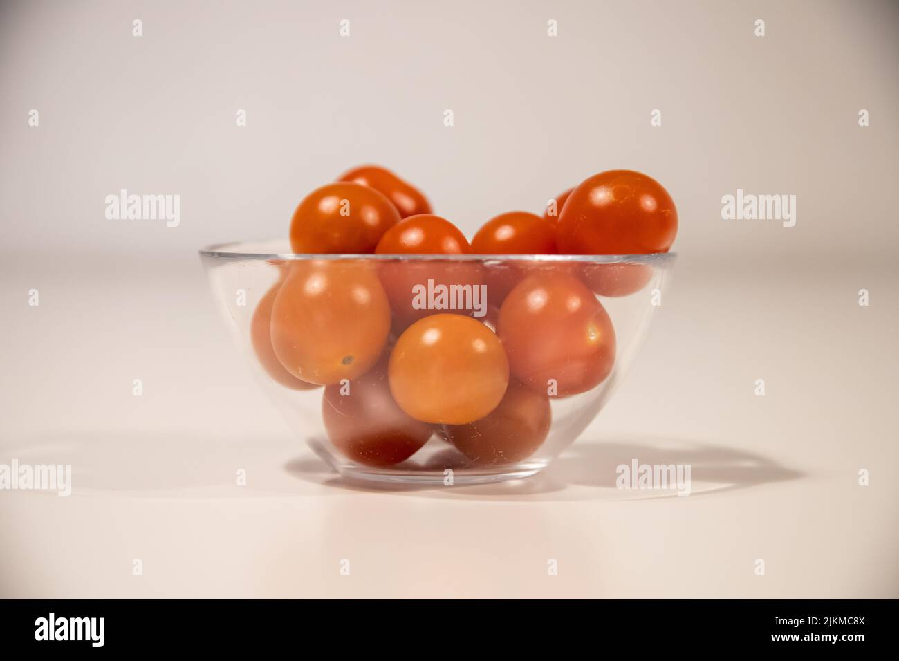 A closeup shot of cherry tomatoes in a bowl Stock Photo - Alamy