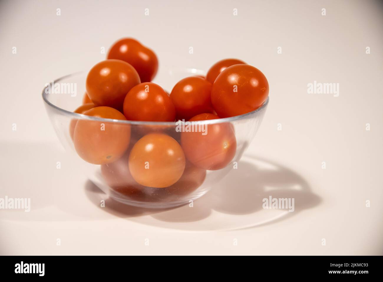 A closeup shot of cherry tomatoes in a bowl Stock Photo - Alamy