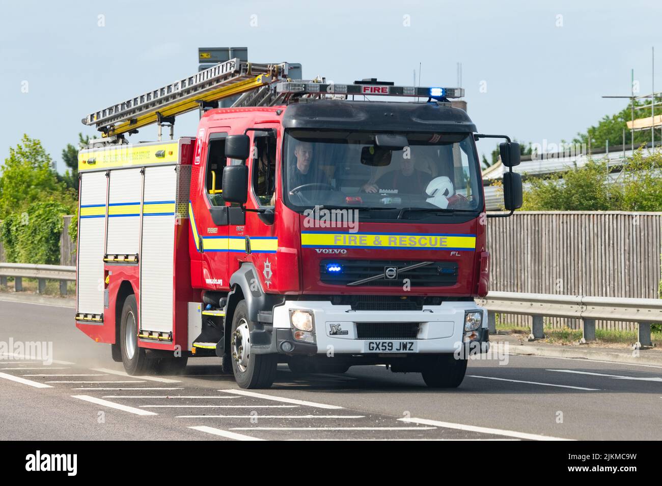 Fire Engine with blue flashing lights responding to an emergency in ...