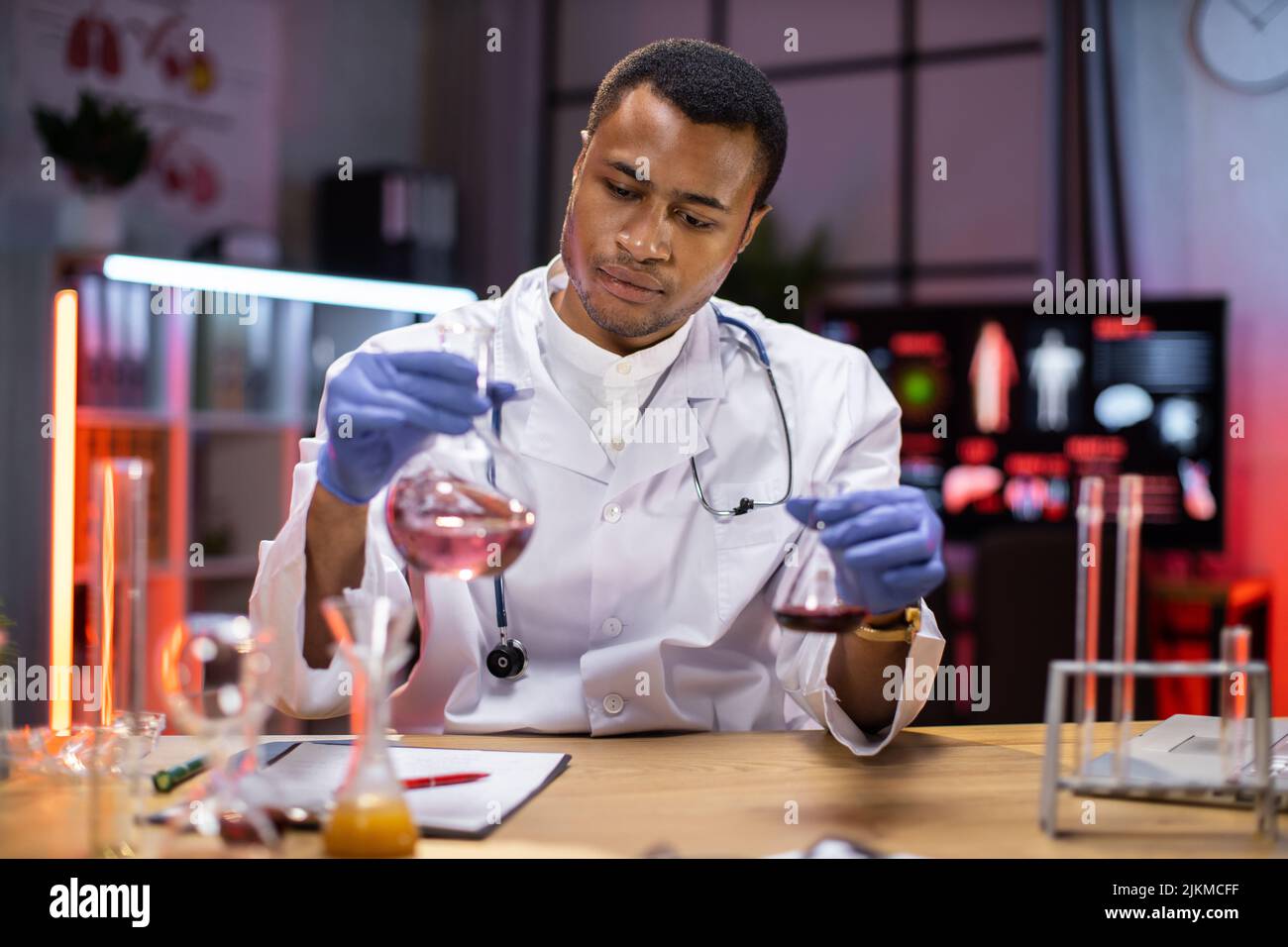 Positive male african scientist or medical in lab coat holding test ...