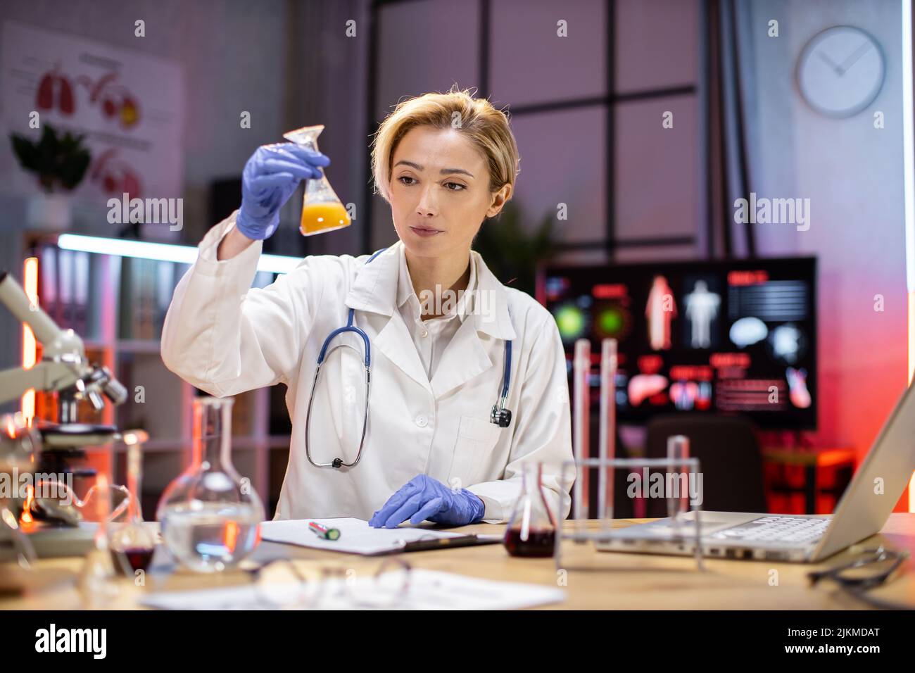 Female scientist working in modern lab. Doctor making microbiology ...