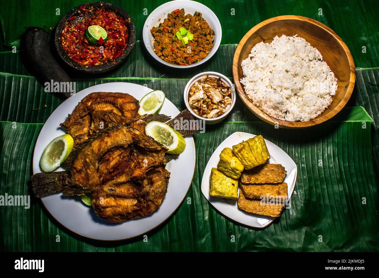 A feast with gourami fish, oncom, fried cabbage, tofu, tempeh, sabal ...