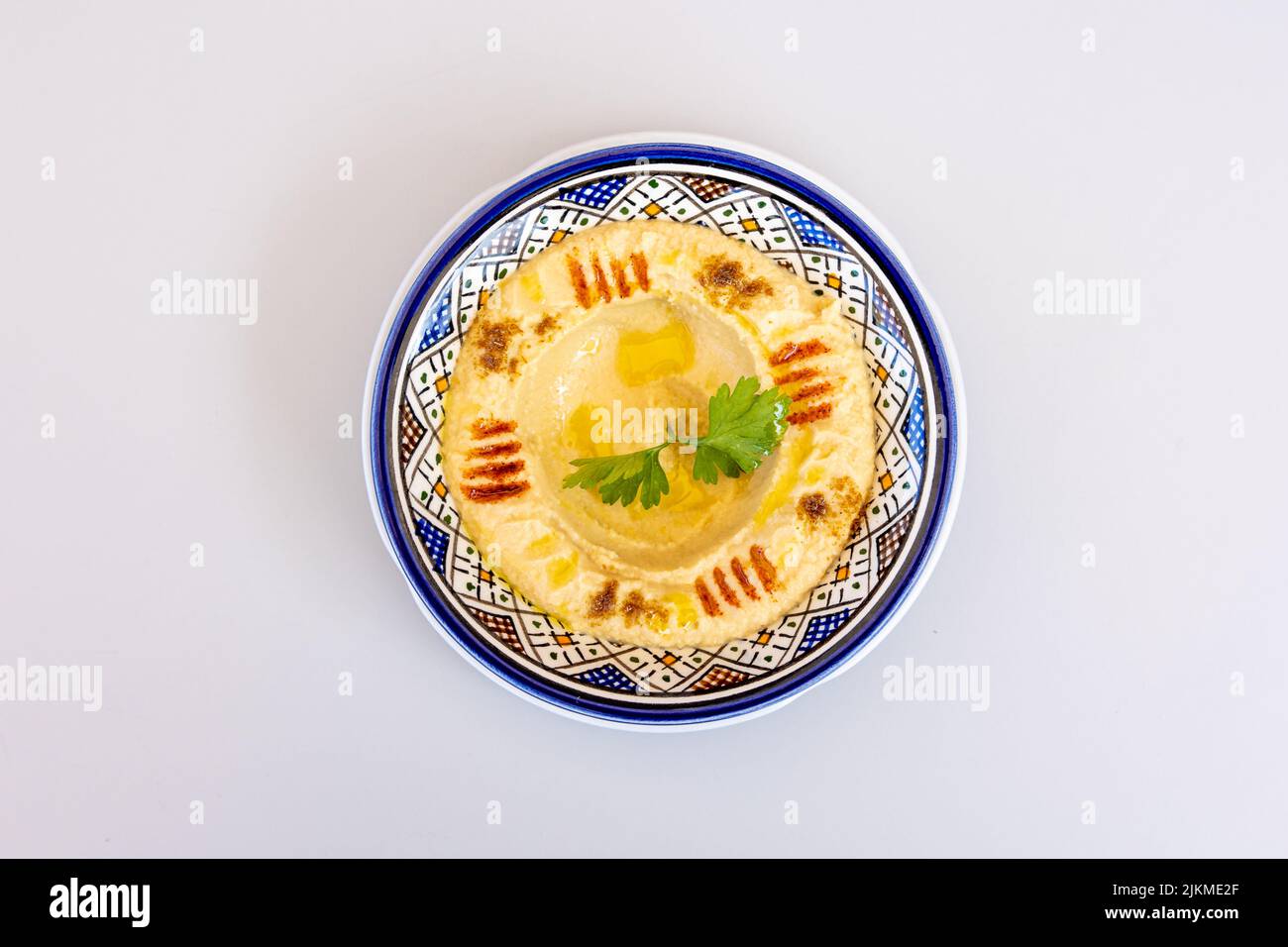 The top shot of the traditional hummus dish in plate on table Stock ...