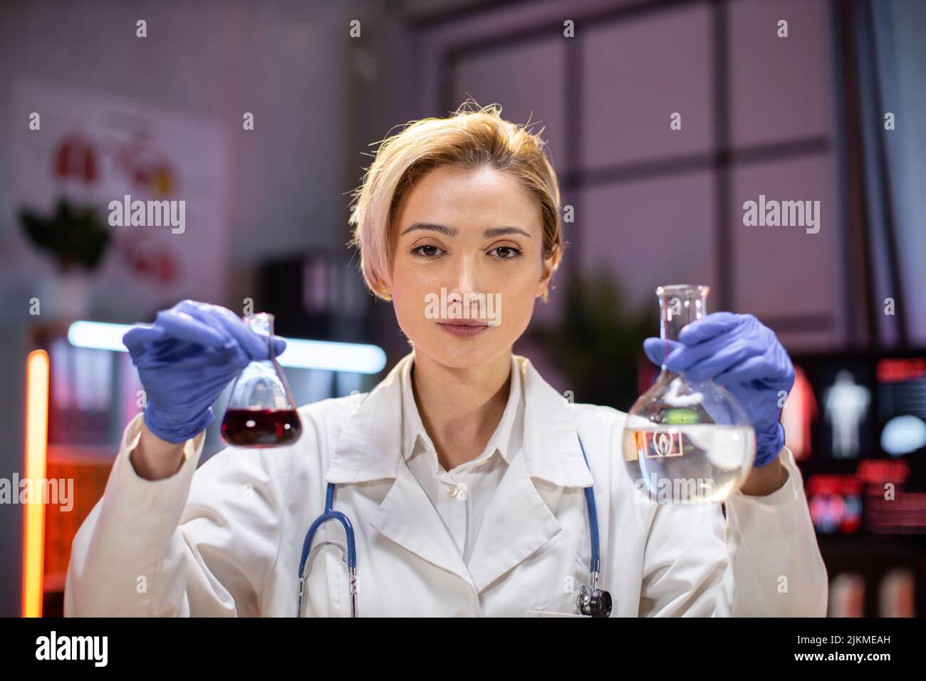 Focus on test tube. Scientific innovations. Positive smart enthusiastic ...