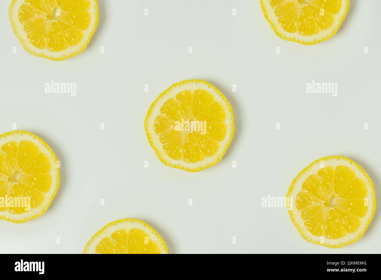 Refresh round lemon slices spread out on white background Stock Photo ...