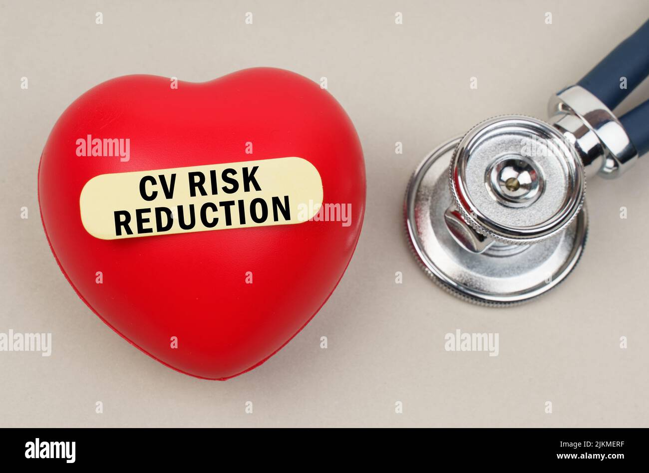 Medicine concept. Near the stethoscope lies a heart on which a sticker is pasted with the ...