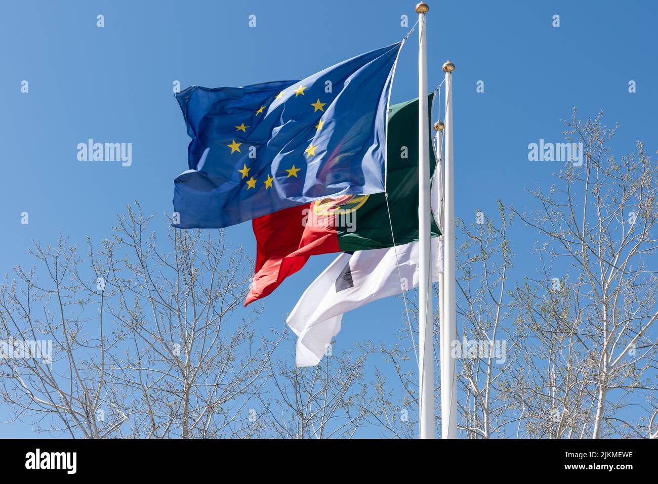 A closeup shot of the European Union flag and flag of Portugal, Lisbon ...