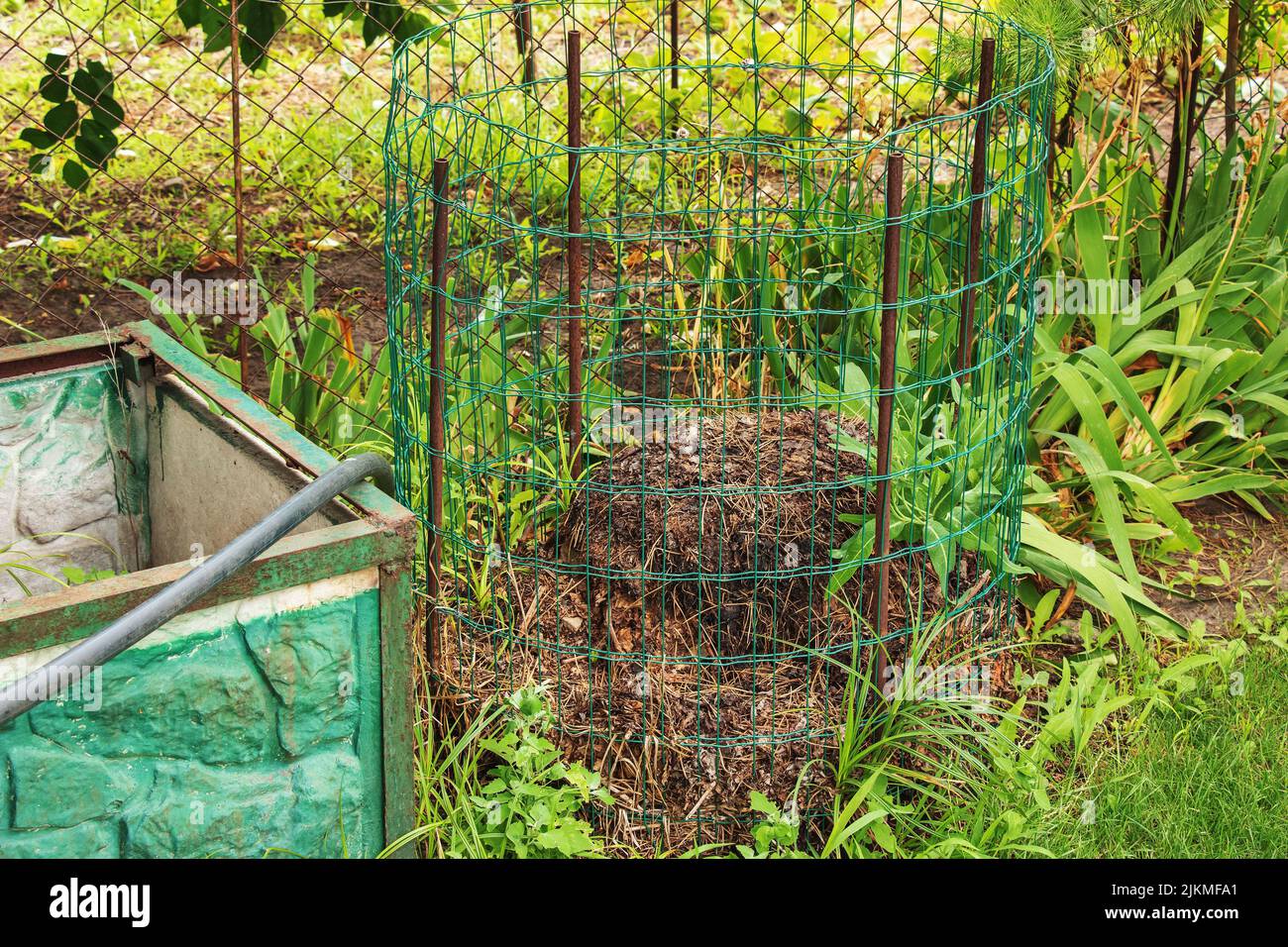 An unusual container for branches, leaves and debris in the garden. The ...