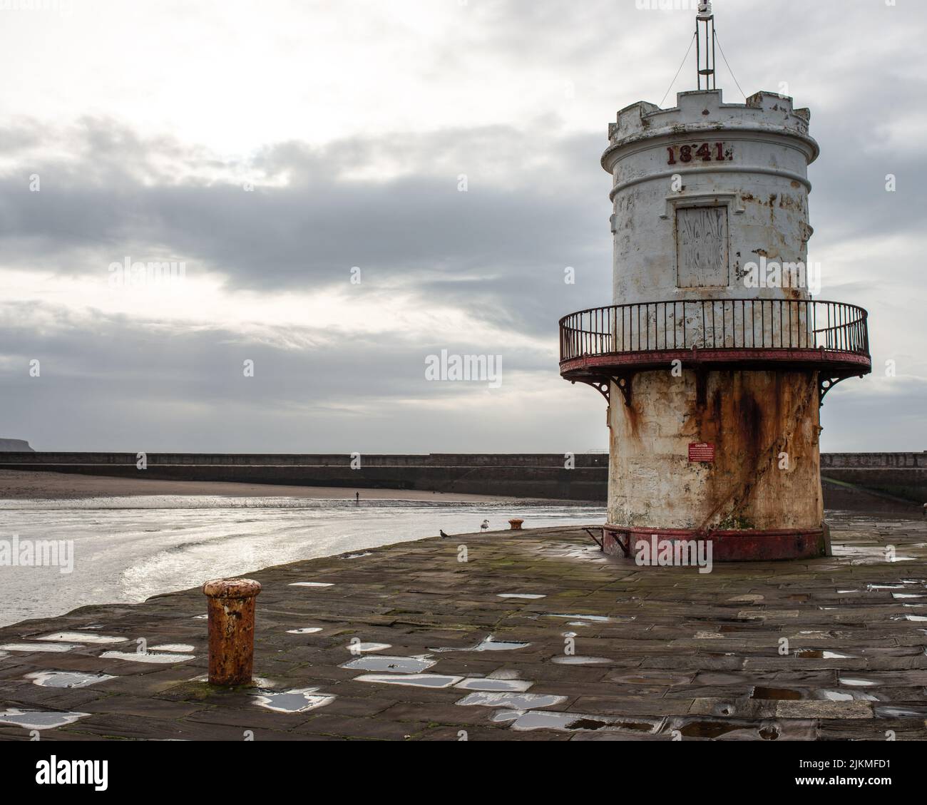 A beautiful view of the old lighthouse in Whitehaven harbor under ...