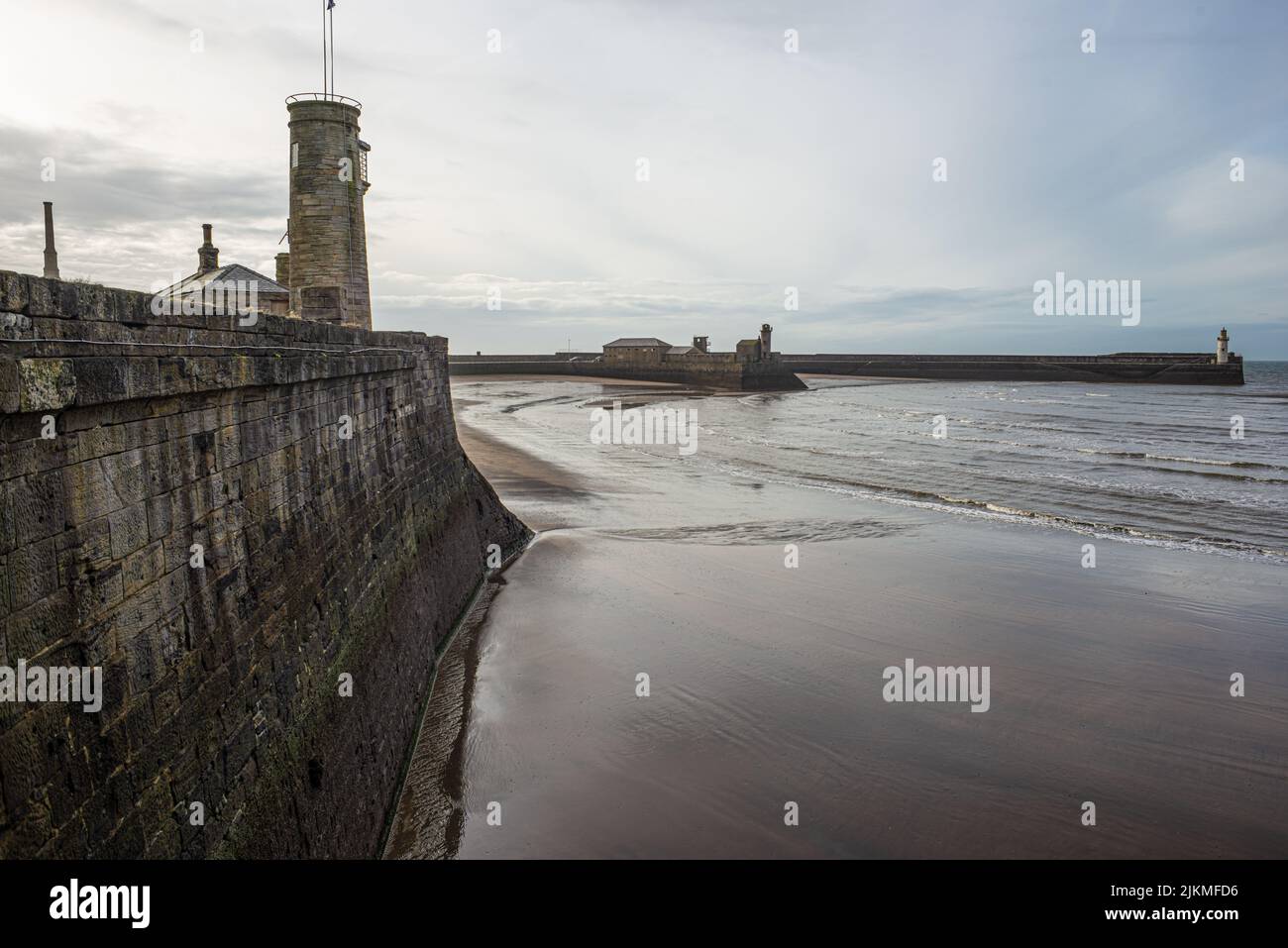 A beautiful view of the old lighthouse in Whitehaven harbor under ...