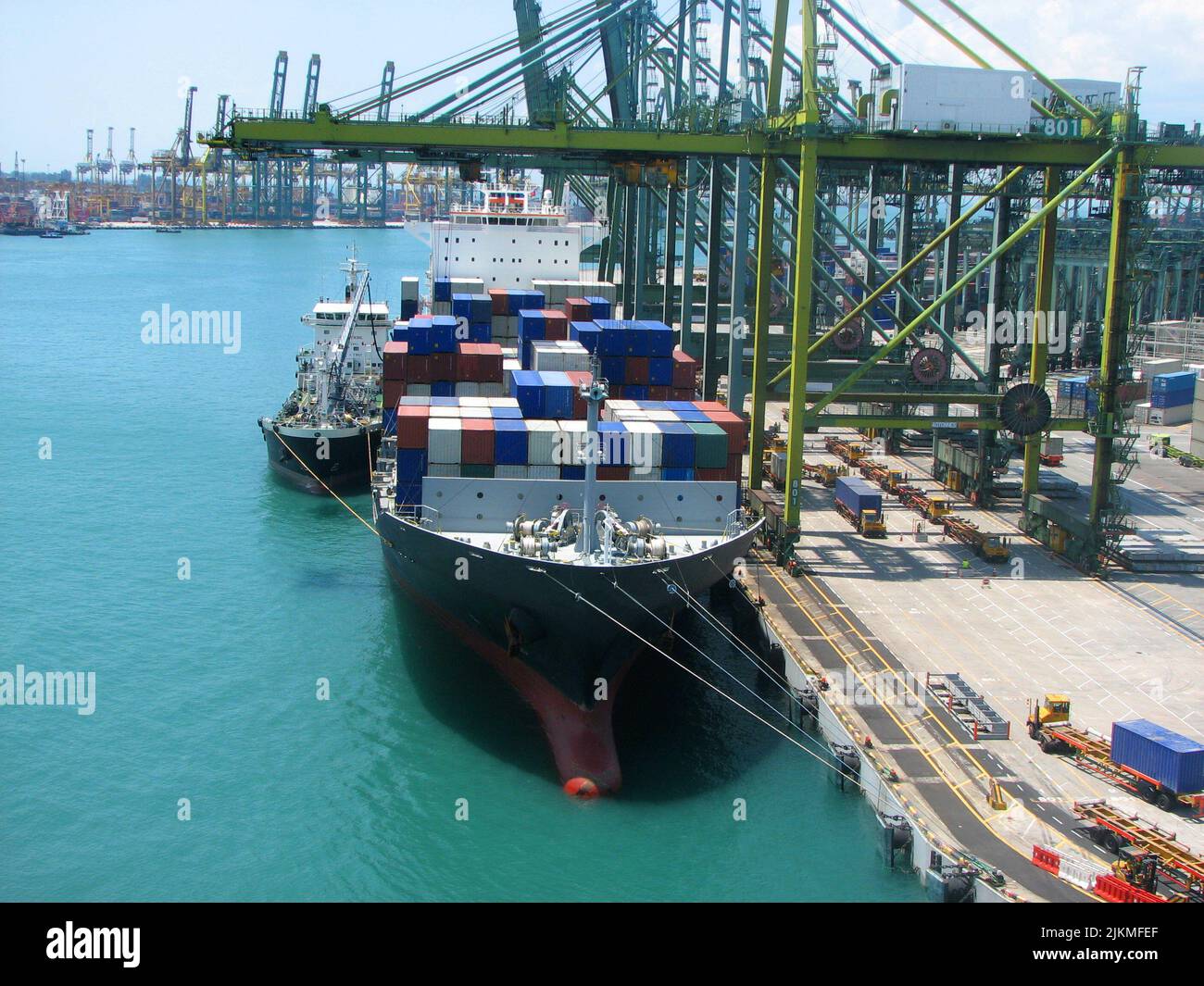 Bunkering tanker container ship in port Stock Photo - Alamy