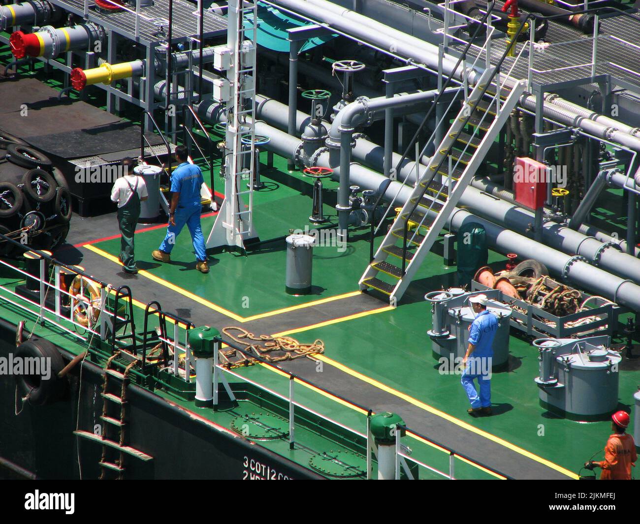 Bunkering tanker container ship in port Stock Photo - Alamy