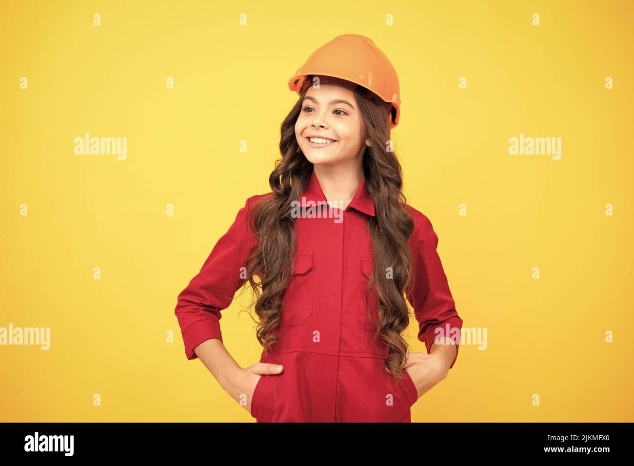 happy teenager girl in safety hard hat, builder Stock Photo - Alamy