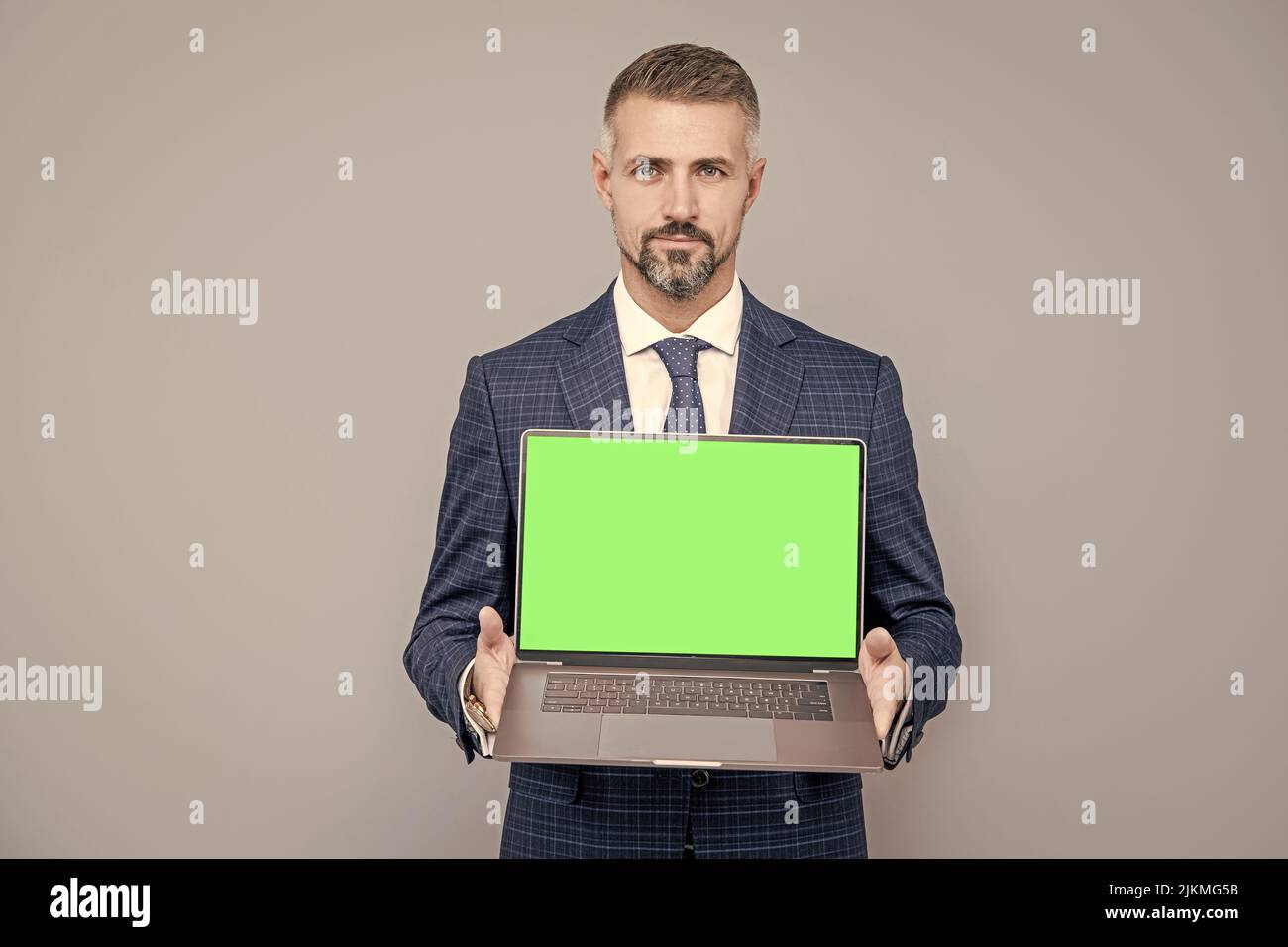 confident businessman man presenting computer green screen, copy space ...