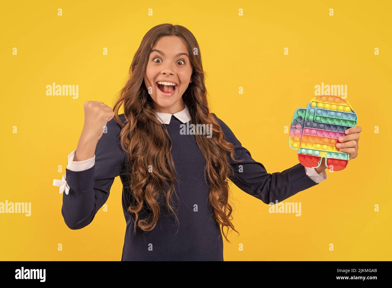 happy girl with finger game. kid popping anti stress bubble. motor skills. pop it fun. yes Stock ...