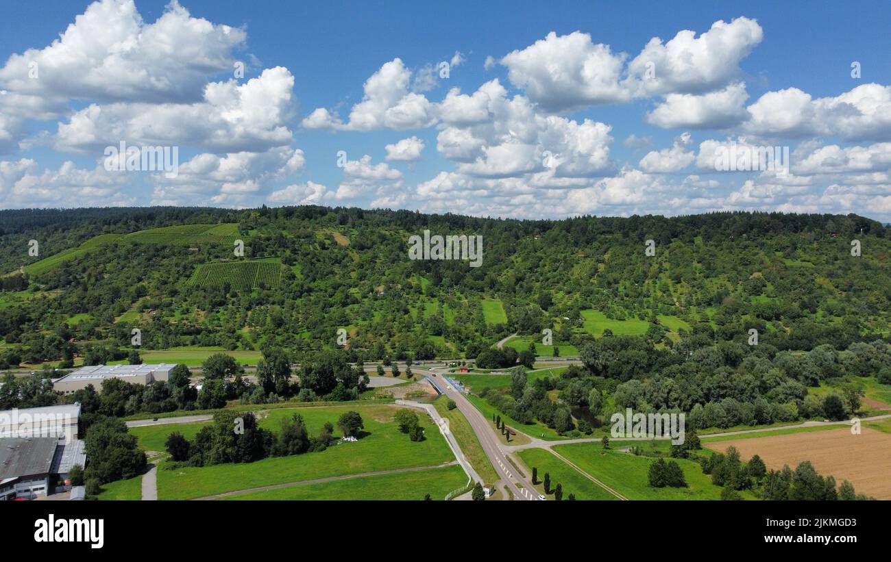 A scenery of a hilly rural area with growing trees Stock Photo - Alamy