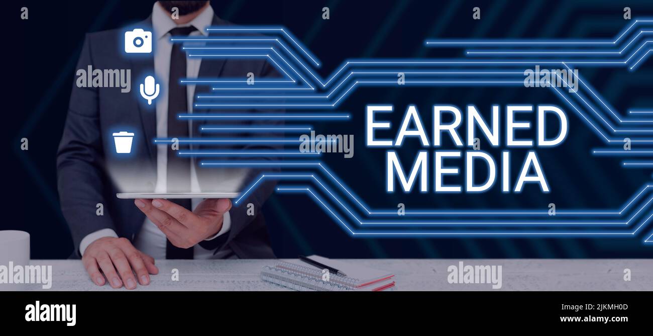 Hand writing sign Earned Media. Business idea Publicity gained through ...