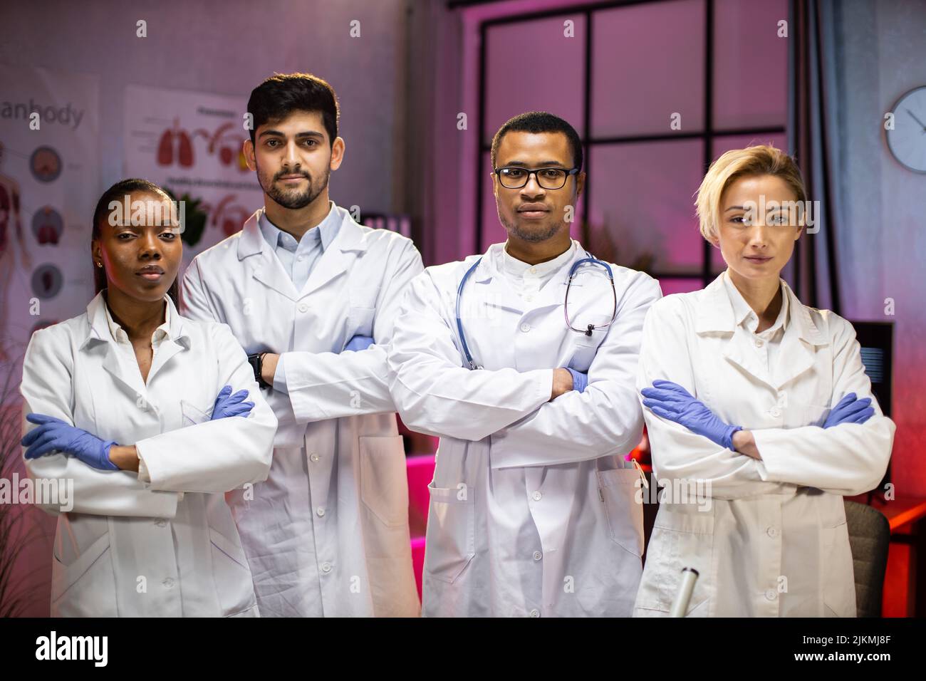 Smiling group of scientists in modern laboratory with male african ...