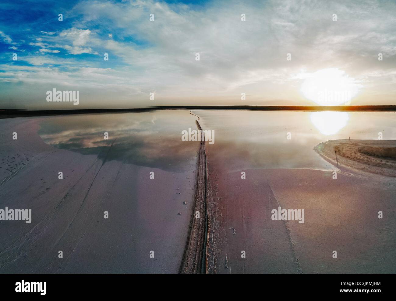 An aerial view of a beach with an ocean in cloudy sky background Stock ...