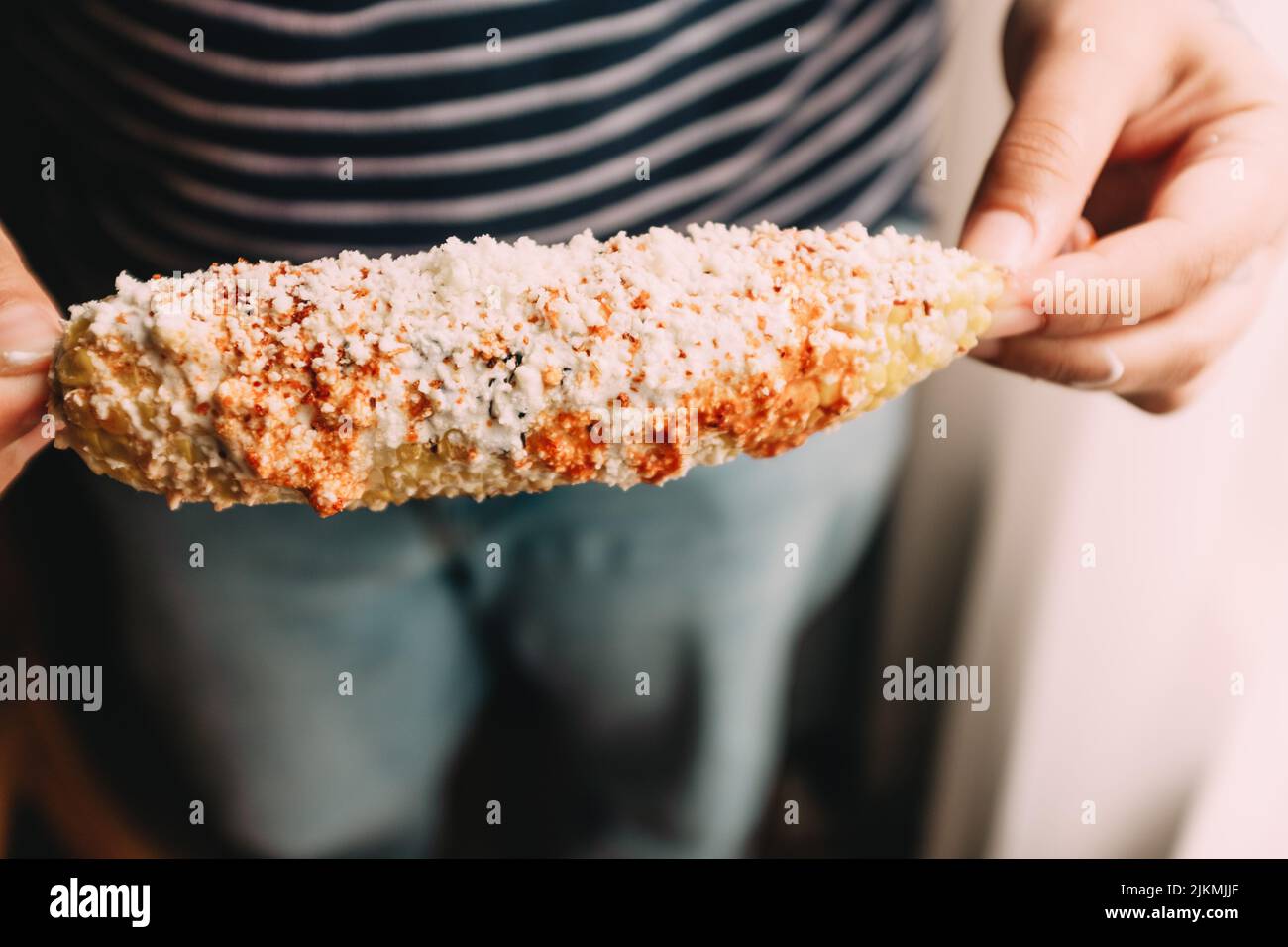 A female's hands holding baked cheese Stock Photo - Alamy