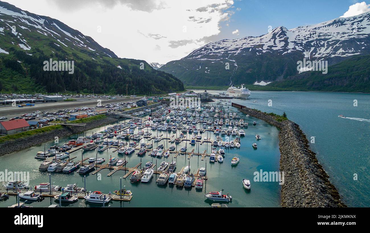 An aerial shot of the Whittier port in Alaska with a cruise ship ...