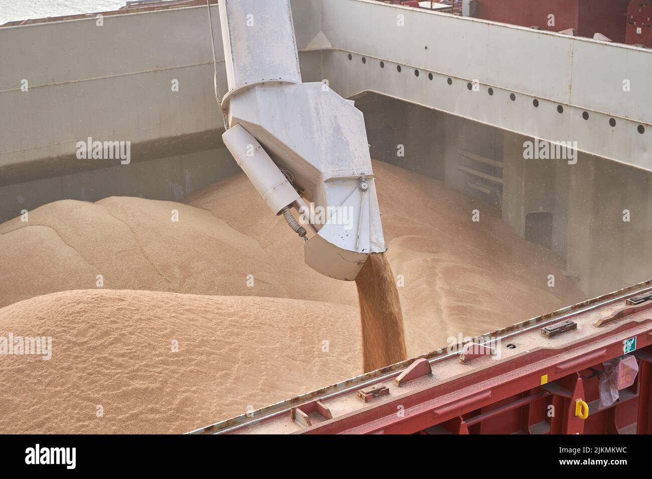 loading corn onto a bulk carrier ship in the port at the grain terminal ...