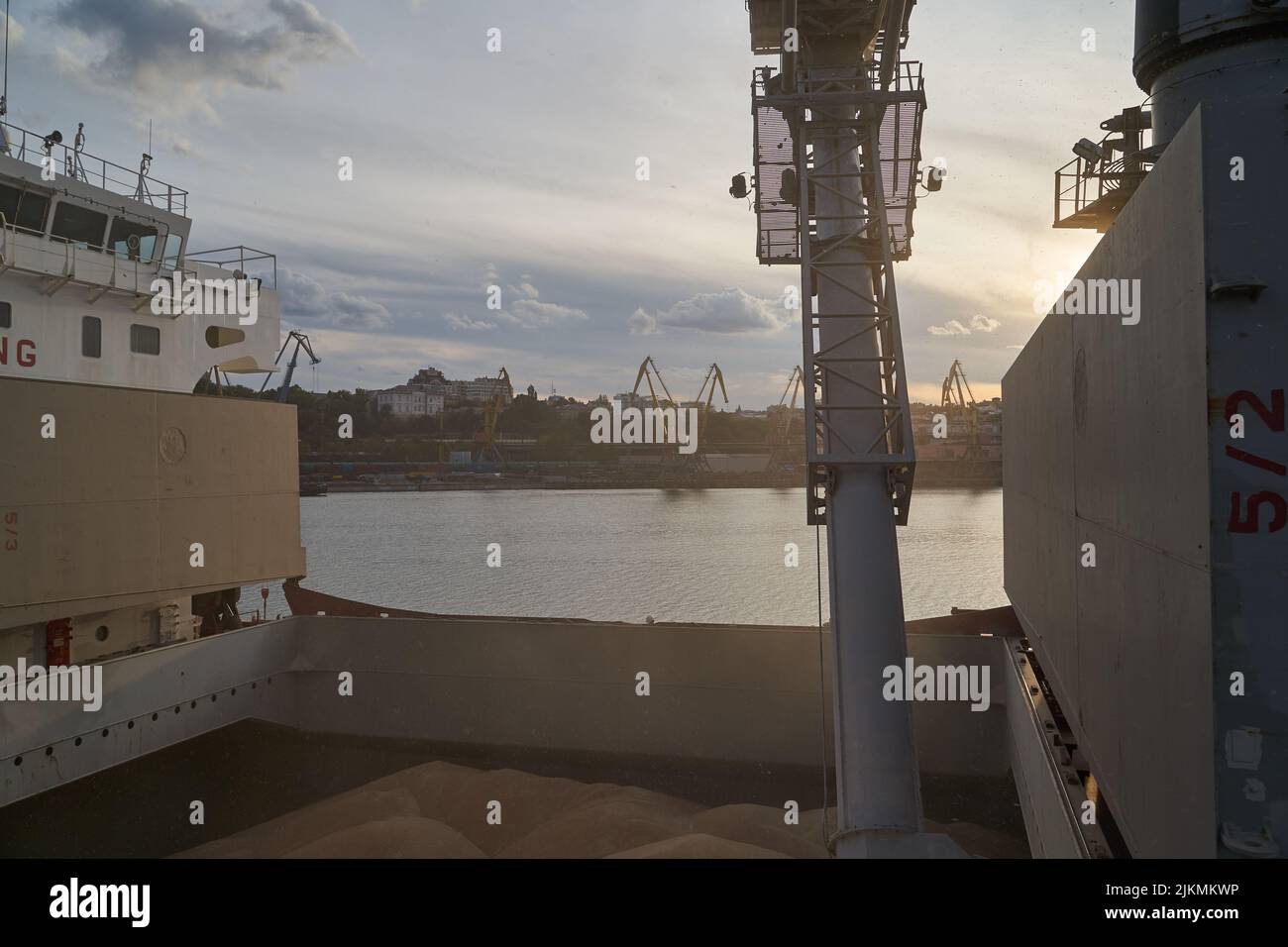 loading corn onto a bulk carrier ship in the port at the grain terminal ...