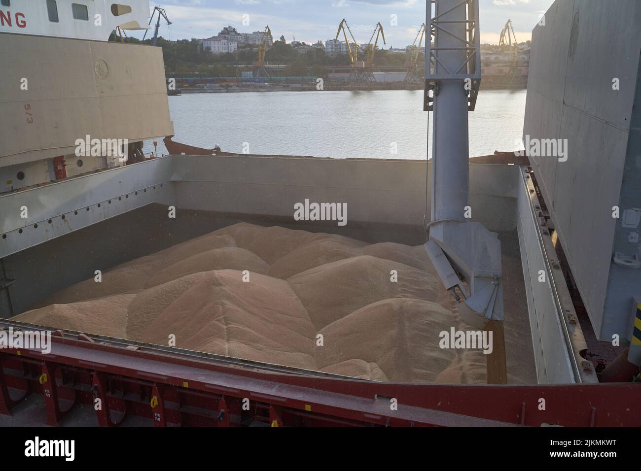 loading corn onto a bulk carrier ship in the port at the grain terminal ...