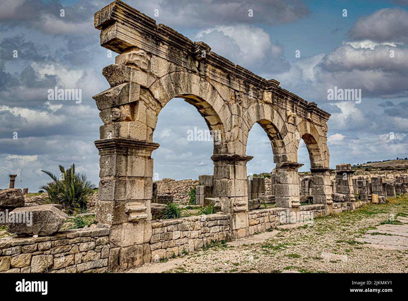A view of the ancient Volubilis Roman city on a cloudy day Stock Photo ...