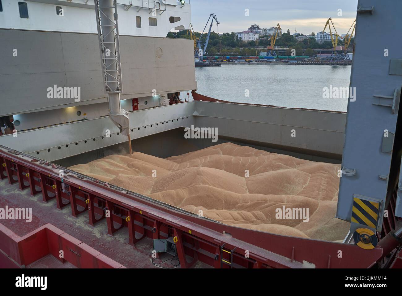 loading corn onto a bulk carrier ship in the port at the grain terminal ...