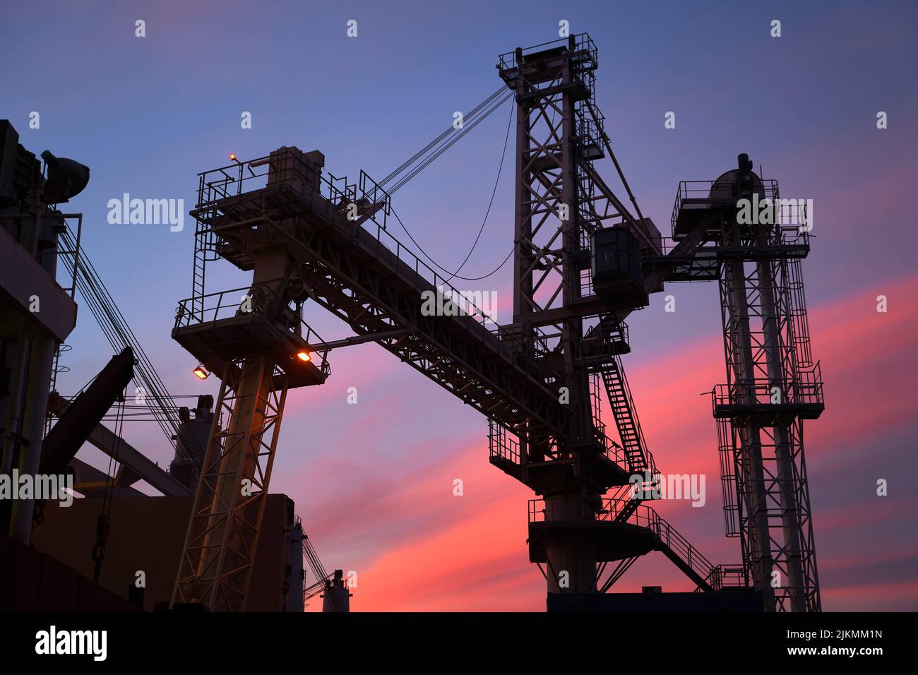 sunset in industrial landscape of commercial seaport. Sunset at seaport ...