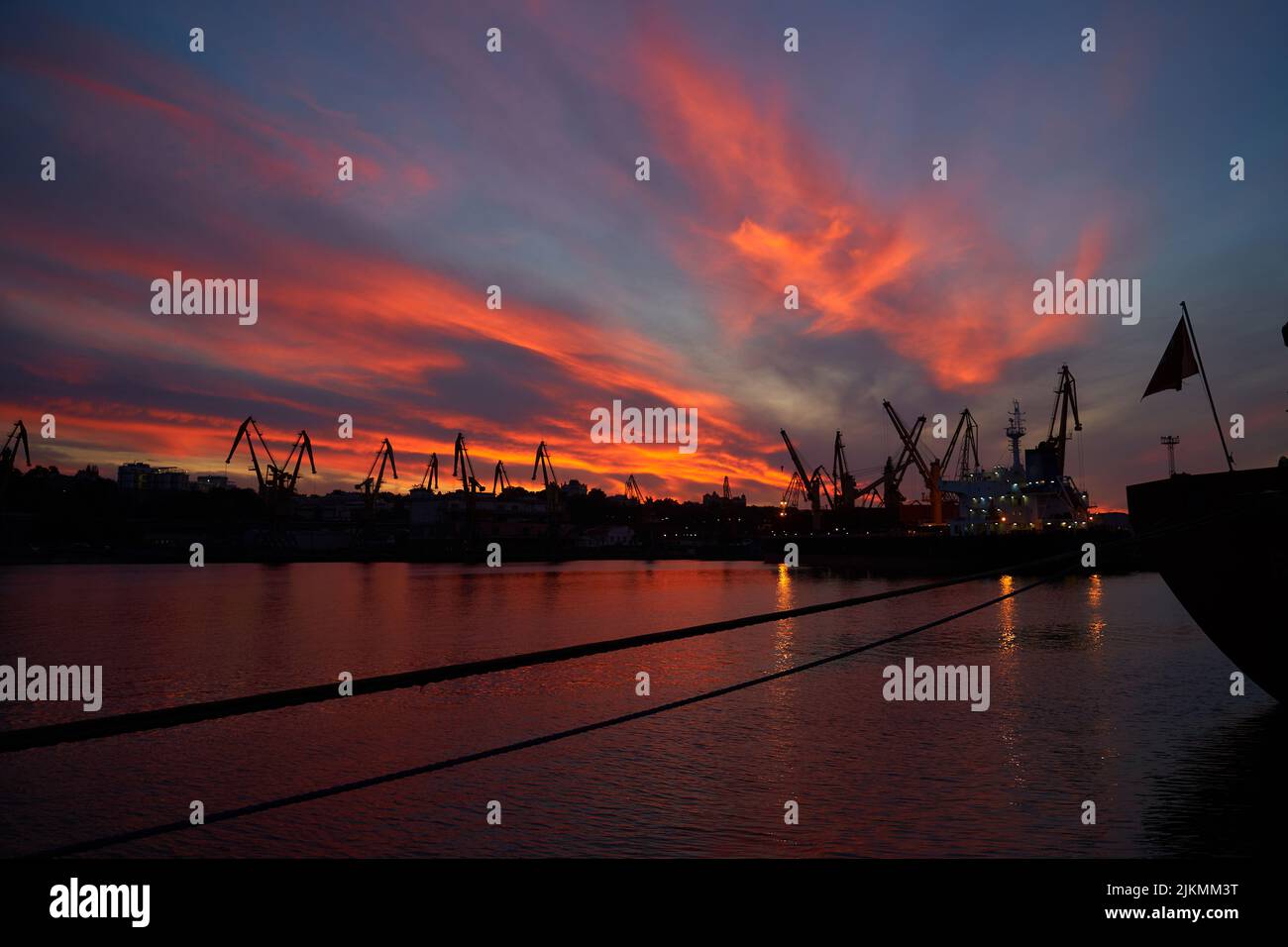sunset in industrial landscape of commercial seaport. Sunset at seaport ...