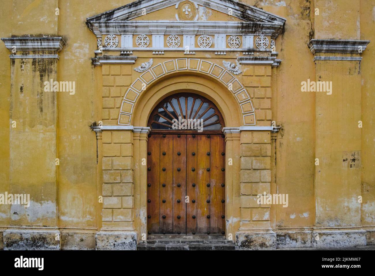 A yellow run-down building in Antigua Guatemala, Guatemala Stock Photo ...