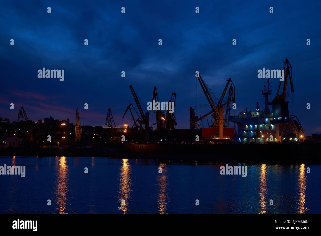 sunset in industrial landscape of commercial seaport. Sunset at seaport ...