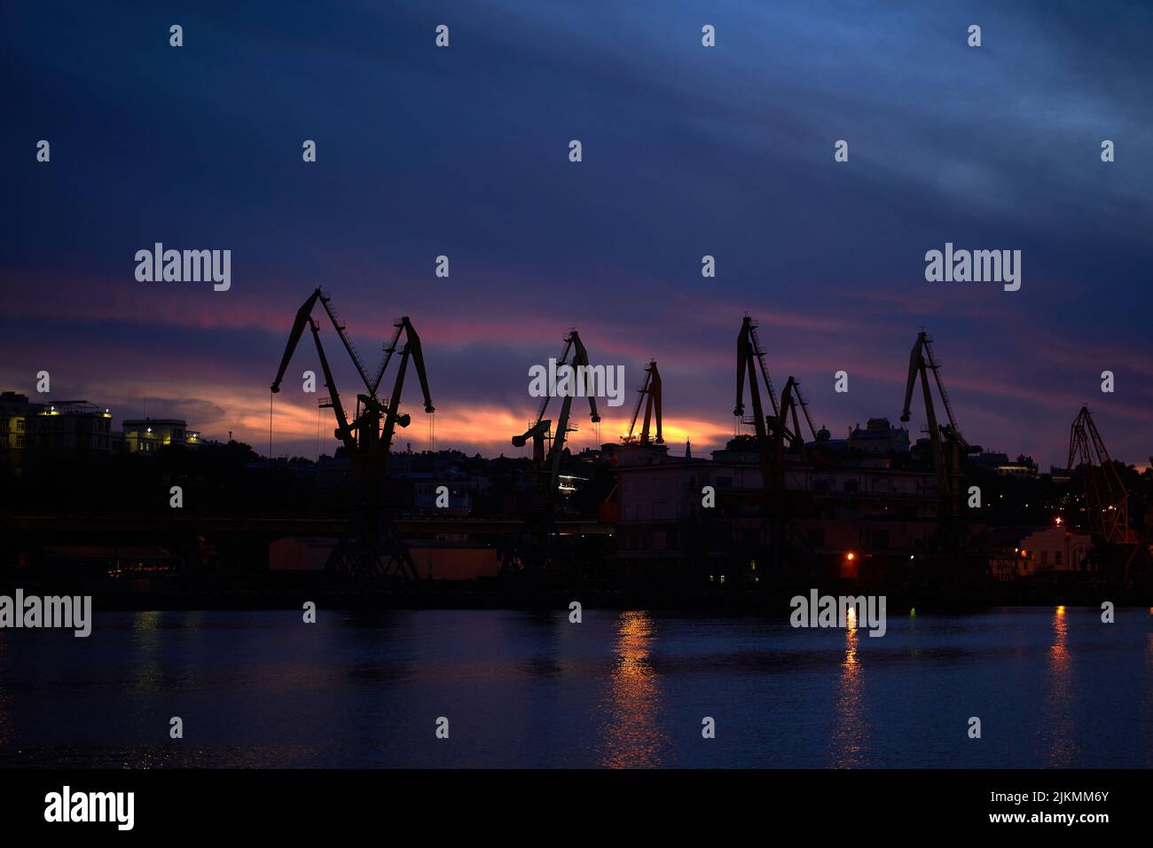 sunset in industrial landscape of commercial seaport. Sunset at seaport ...