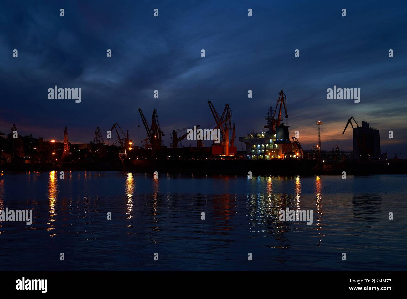 sunset in industrial landscape of commercial seaport. Sunset at seaport ...