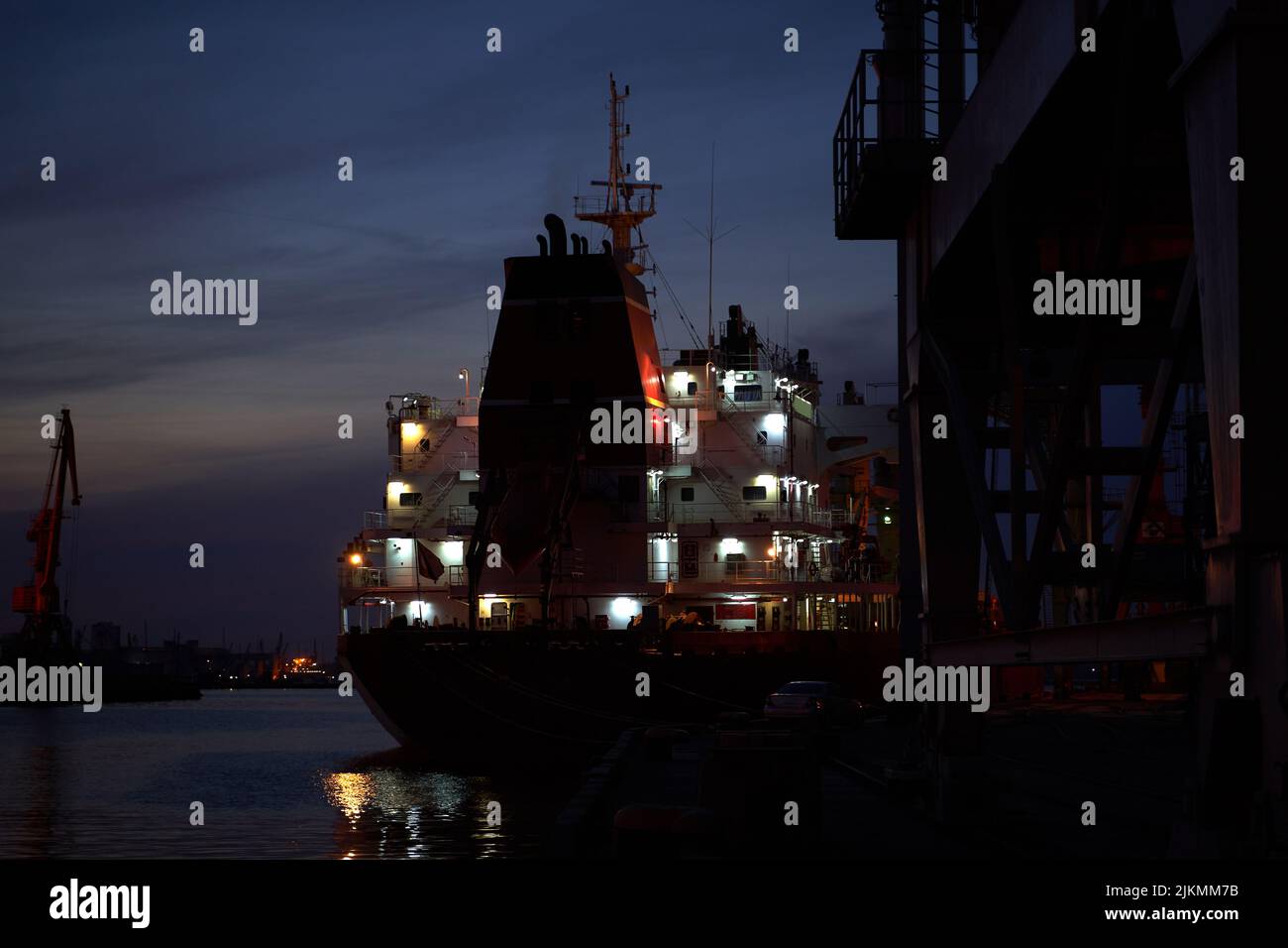 sunset in industrial landscape of commercial seaport. Sunset at seaport ...