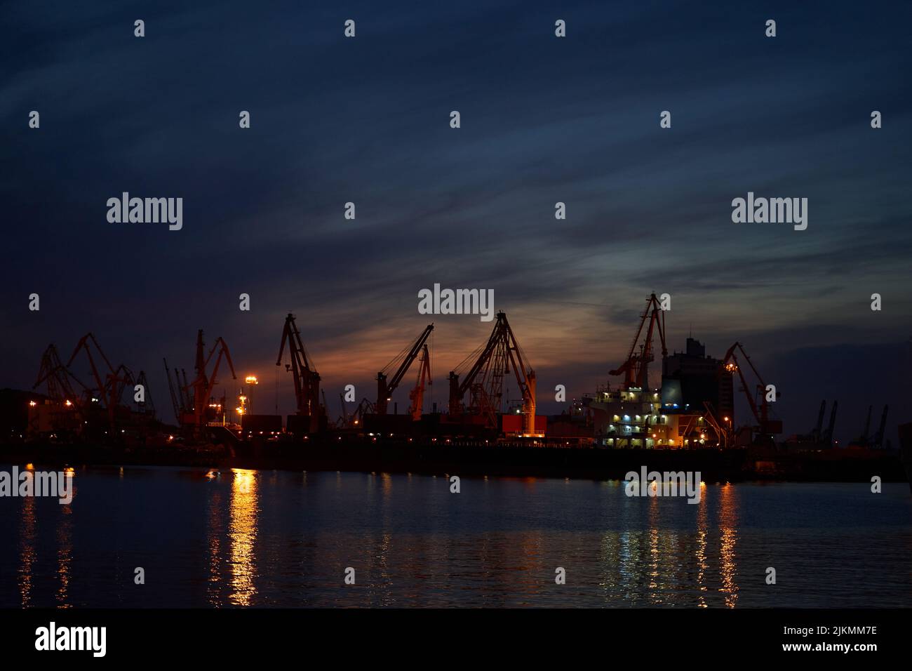 sunset in industrial landscape of commercial seaport. Sunset at seaport ...