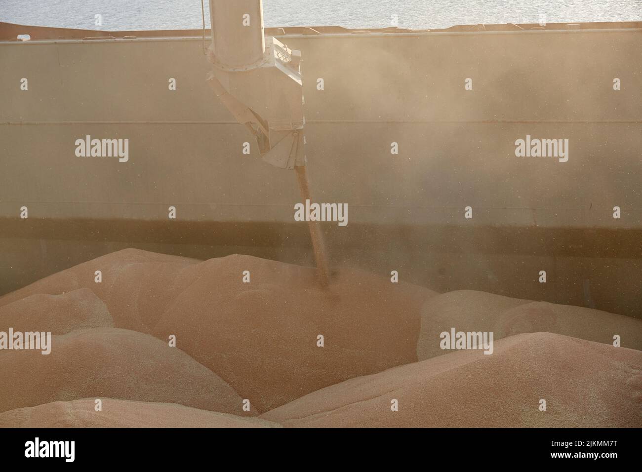 loading corn onto a bulk carrier ship in the port at the grain terminal ...