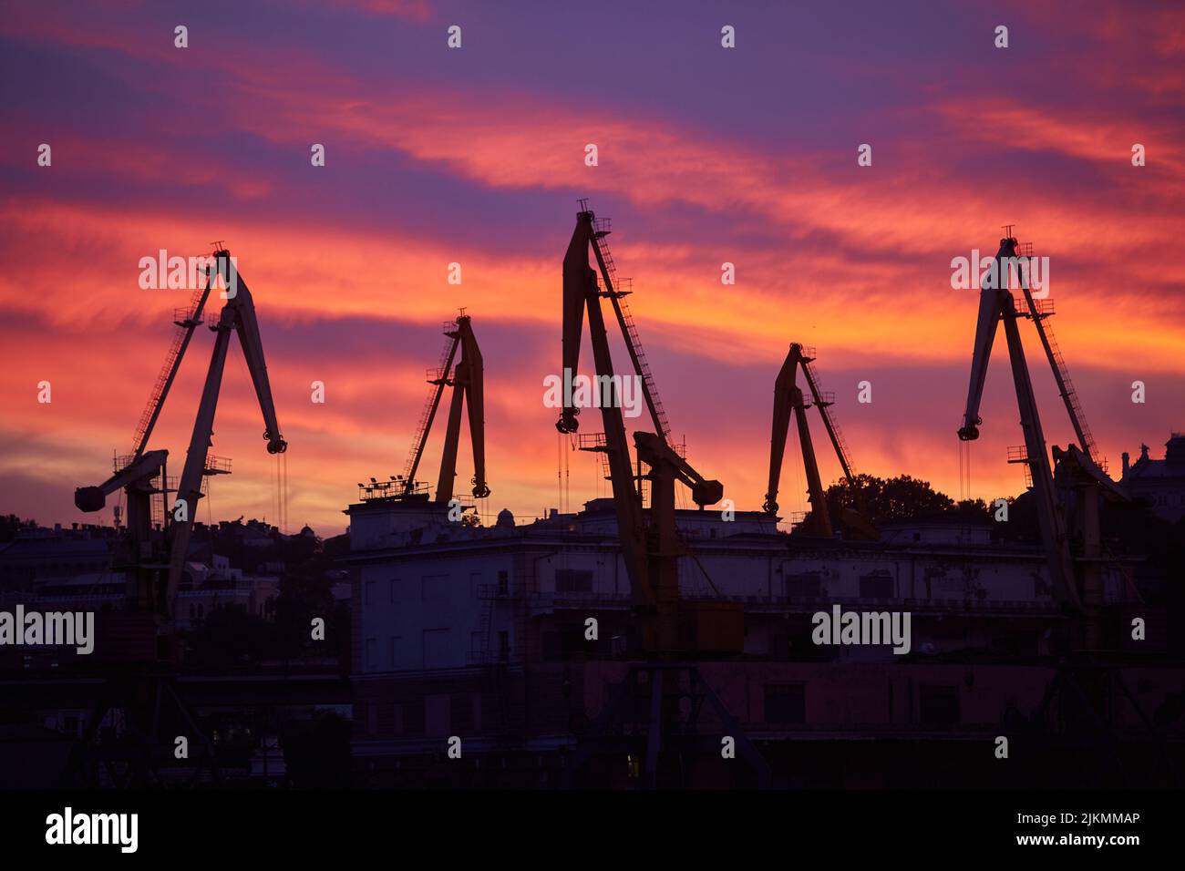 sunset in industrial landscape of commercial seaport. Sunset at seaport ...