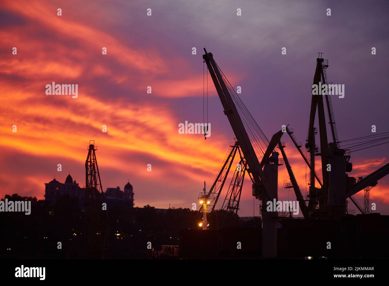 sunset in industrial landscape of commercial seaport. Sunset at seaport ...