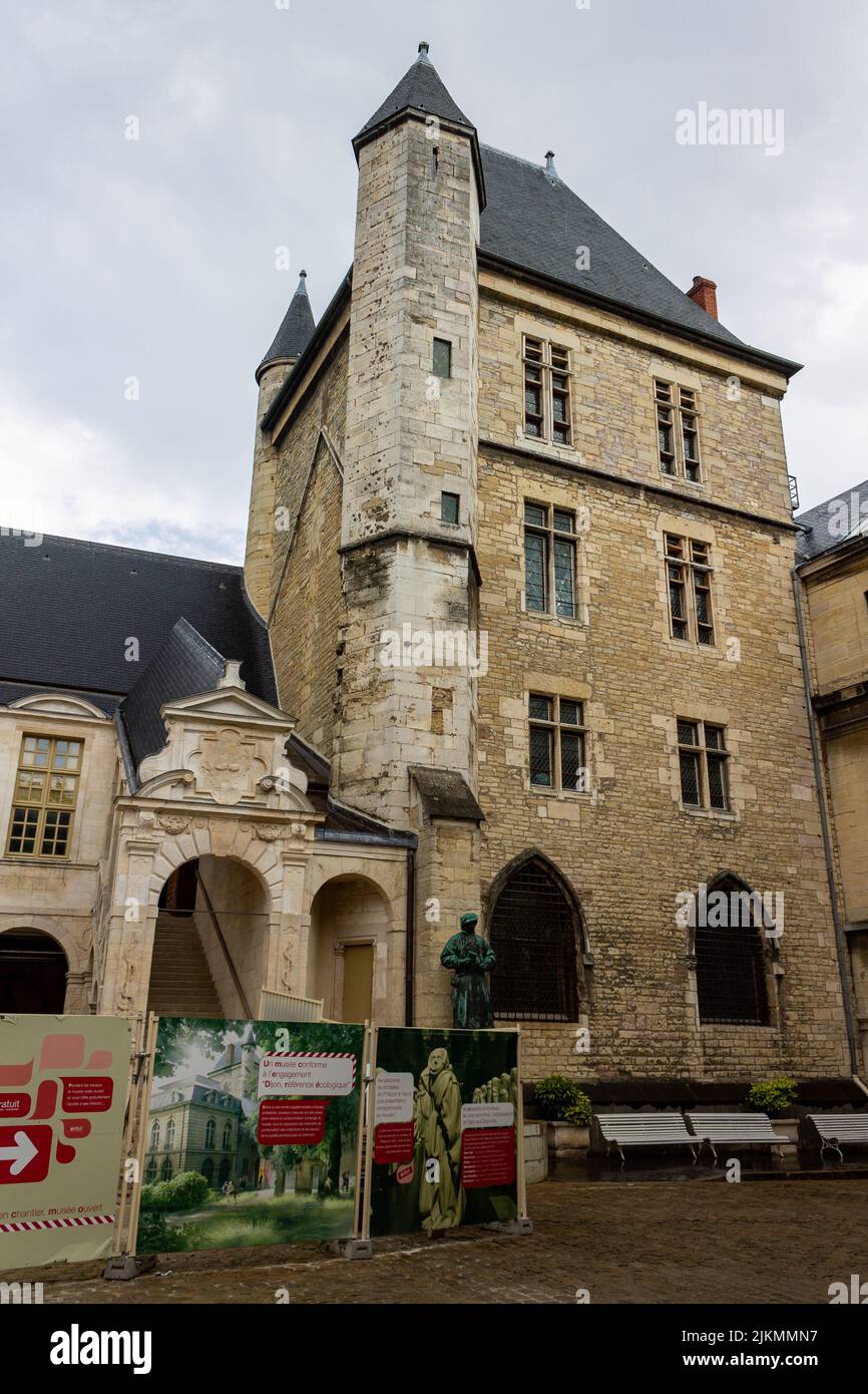 A vertical shot of an old building facade against the sky, the ...