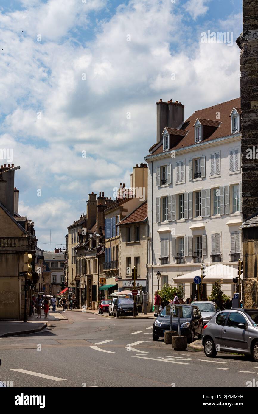 A vertical shot of old building facades against the sky, the ...