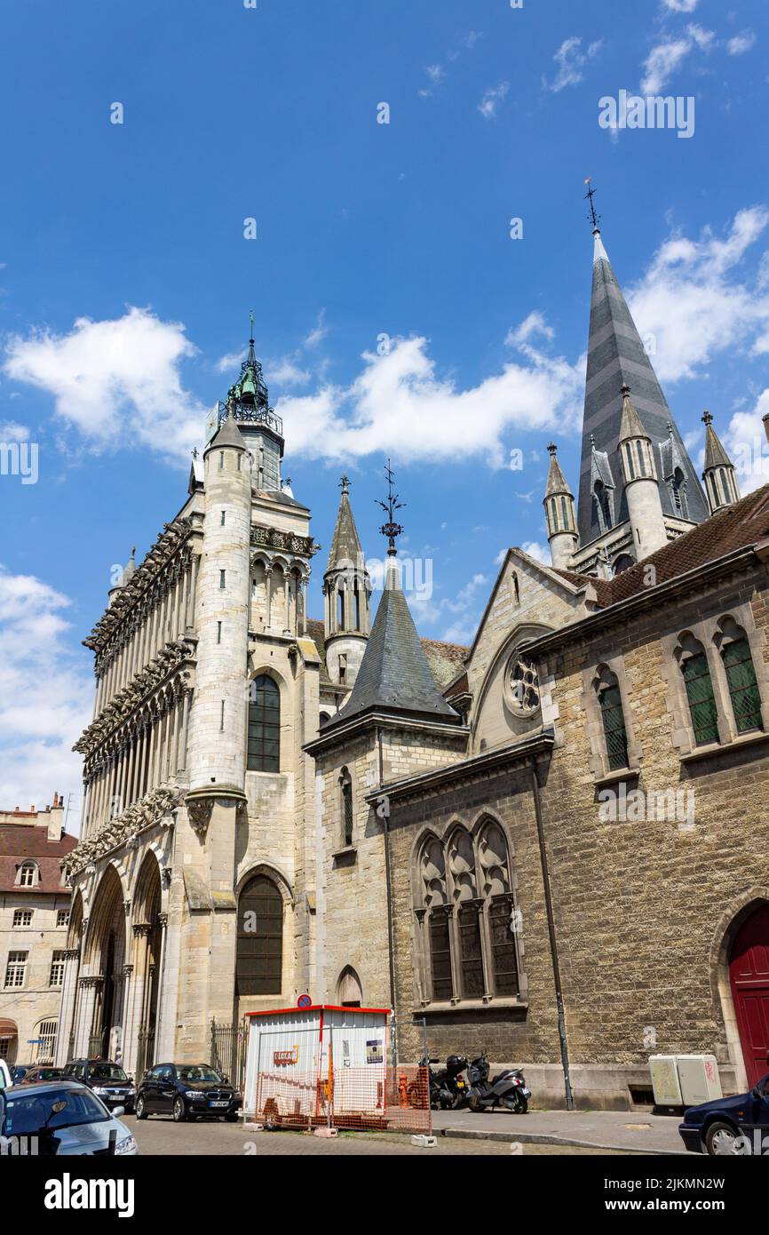 A vertical shot of the historical Notre-Dame de Dijon church against ...