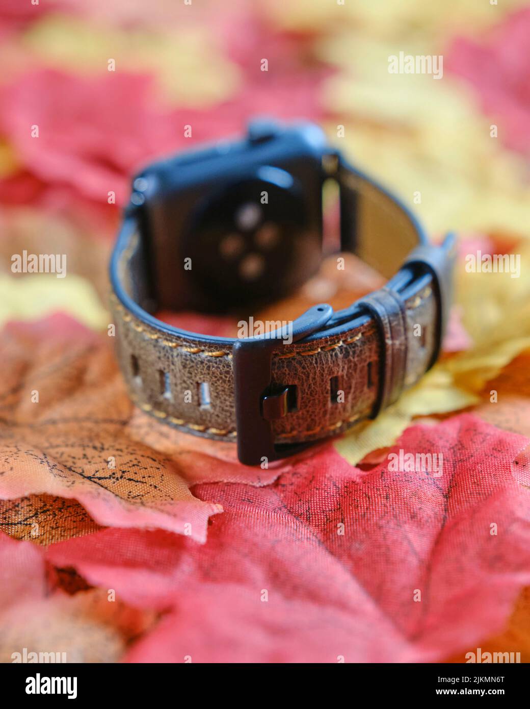 A vertical shot of a modern smartwatch Stock Photo - Alamy