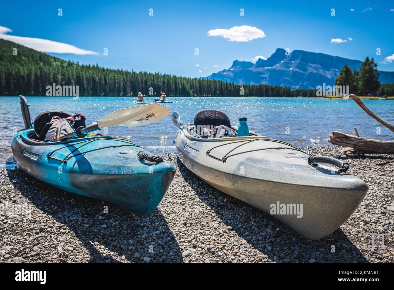 A closeup of two boats moored on the lakeside. Kayaking in Canada Stock ...