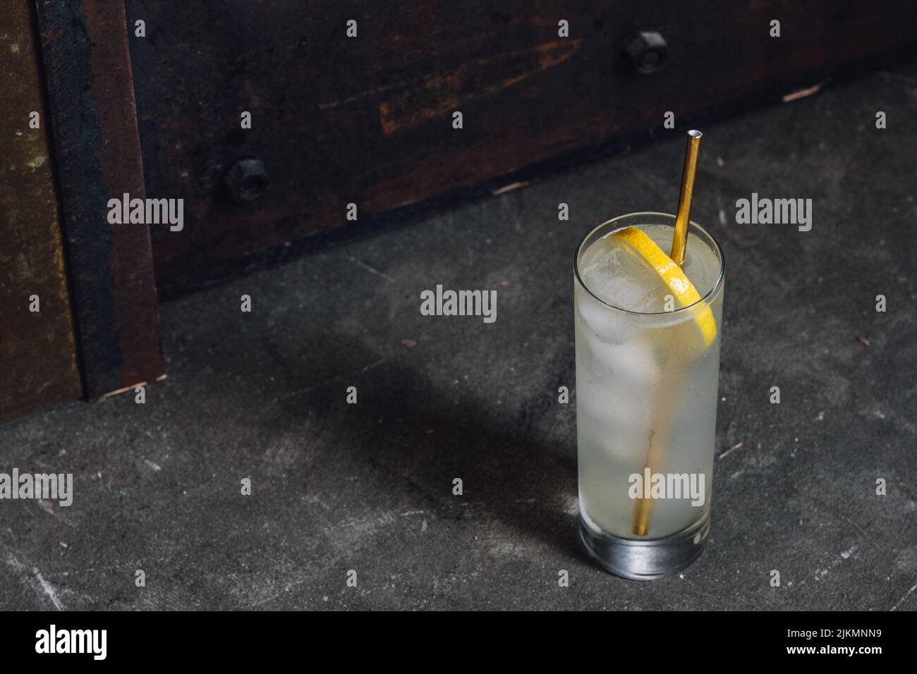 tom collins soda water cocktail in tall glass with lemon wheel, ice ...
