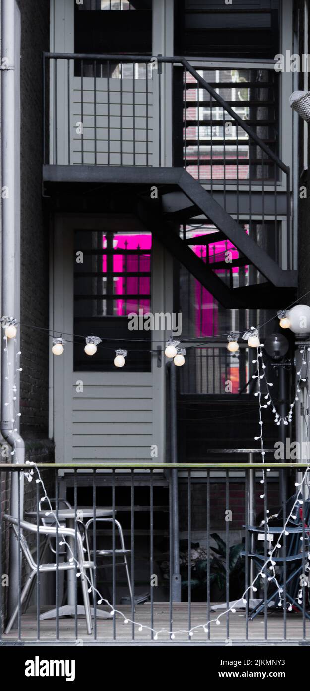 A wallpaper of modern building with purple lights Stock Photo - Alamy